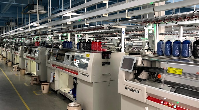 The featured image shows machines in a factory.